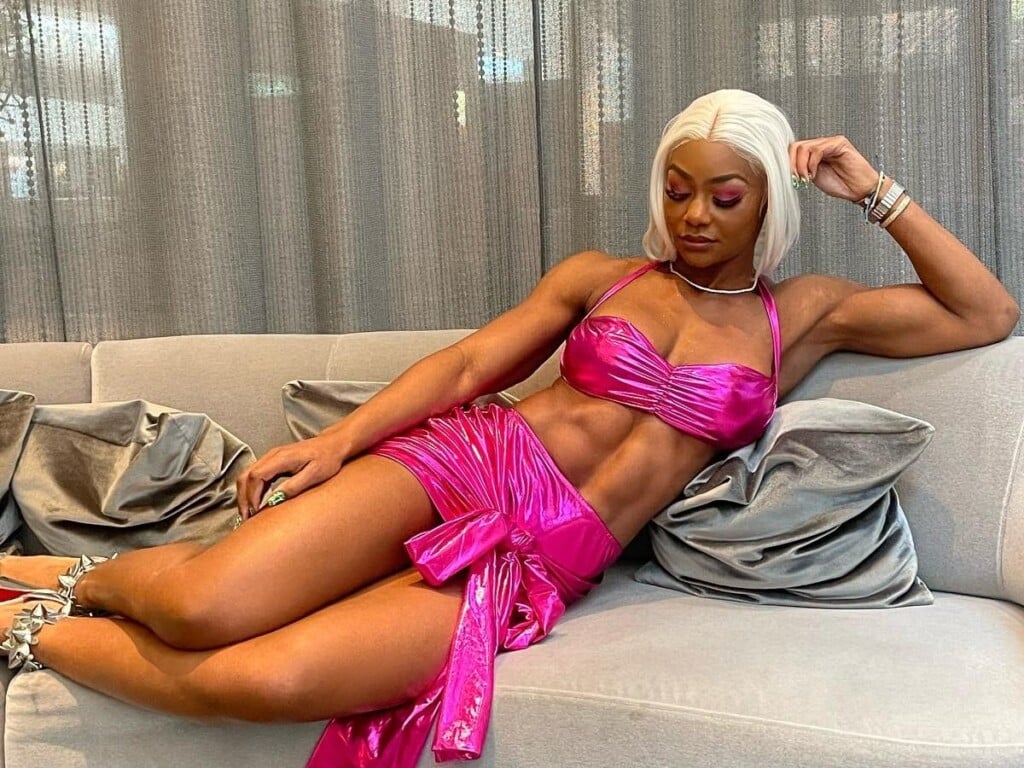 Jade Cargill sets the internet ablaze as she flexes an incredible physique in a pink bikini