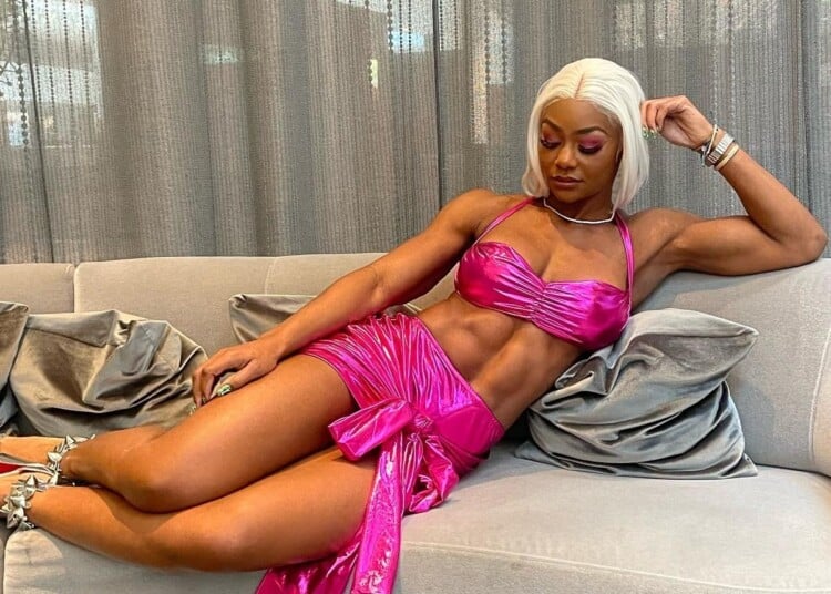 Jade Cargill sets the internet ablaze as she flexes an incredible physique in a pink bikini